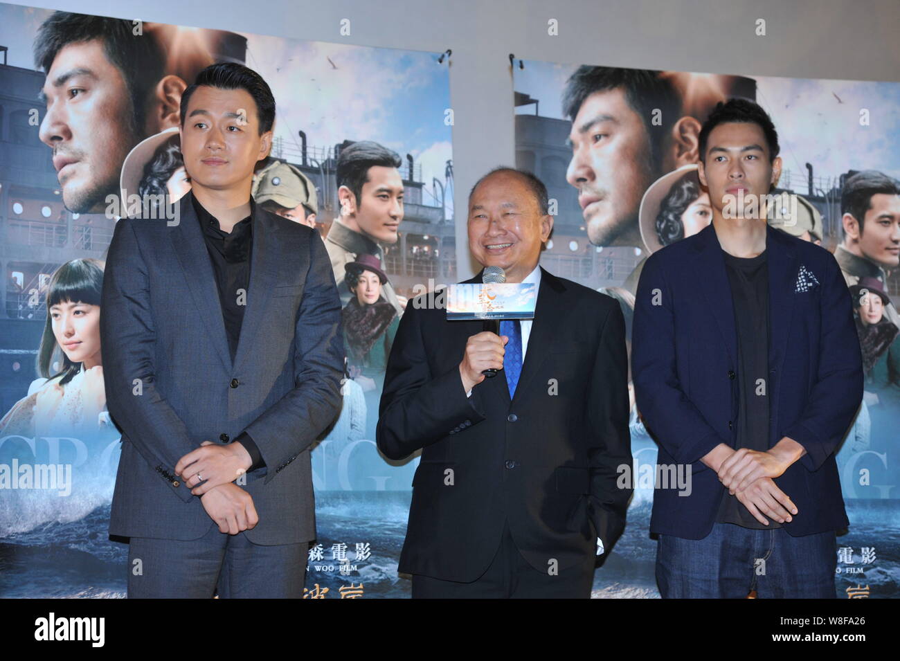 (From left) Chinese actor Tong Dawei, Hong Kong director John Woo and ...