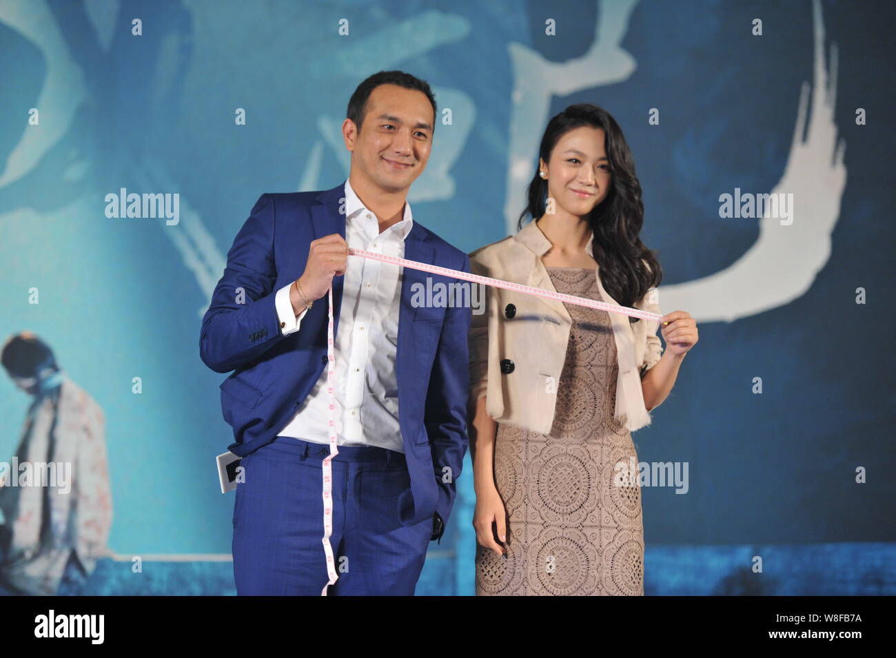 Chinese actress Tang Wei, right, and actor Huang Jue pose during a ...