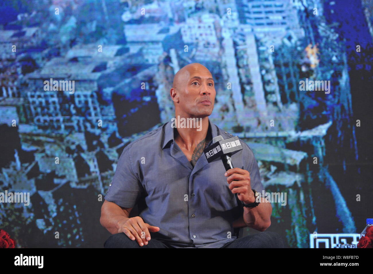 American actor Dwayne Johnson reacts during a press conference for his ...