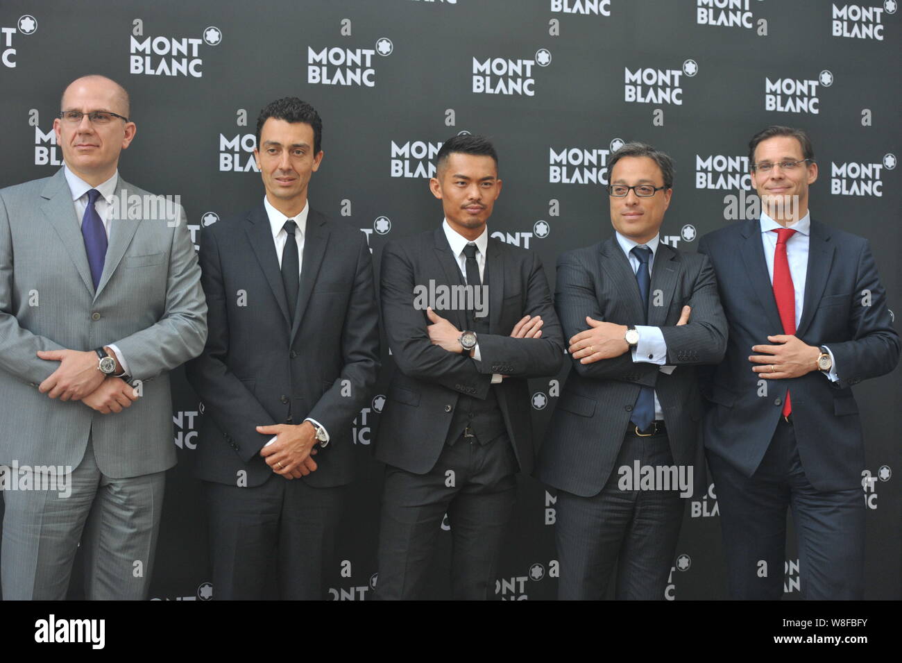 Chinese badminton player Lin Dan, center, poses during a press ...