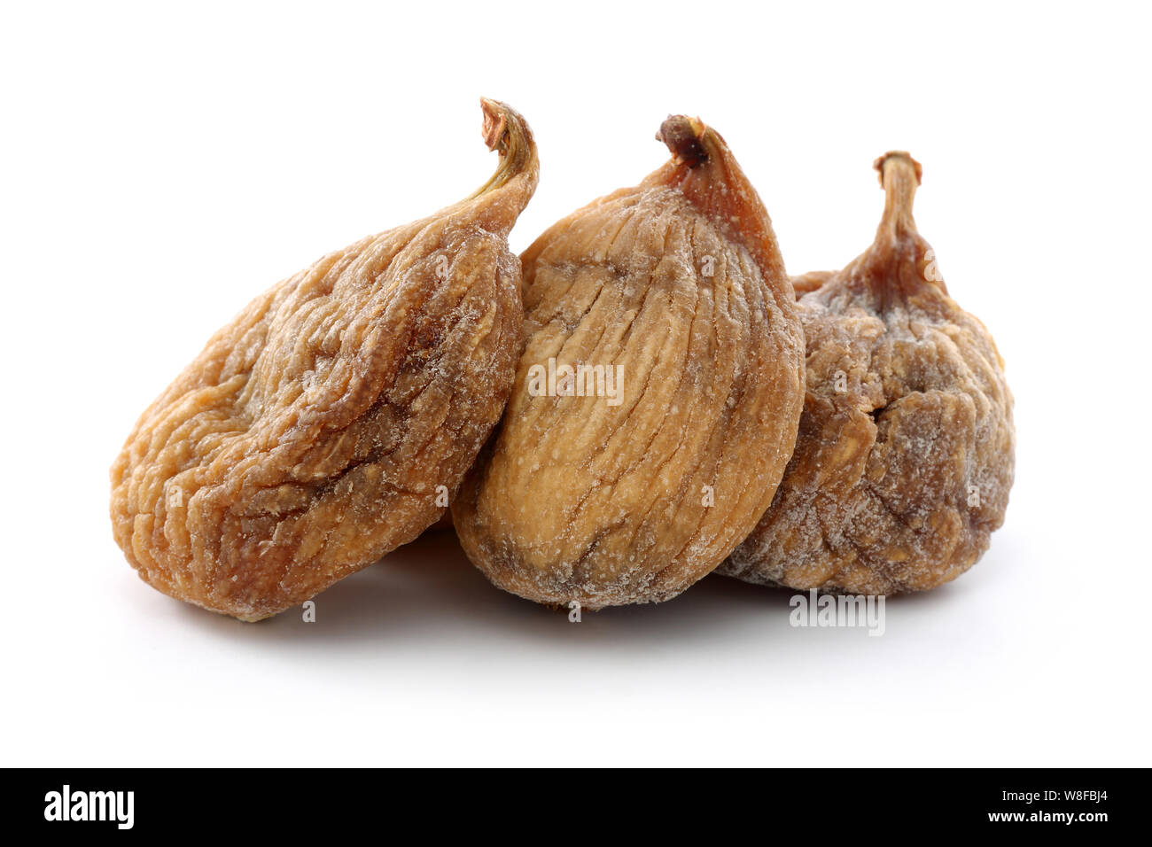 Heap of dried fig fruits isolated on white background Stock Photo - Alamy