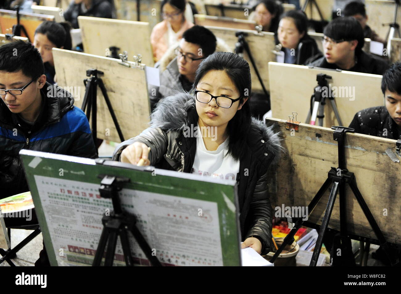 Chinese candidates are drawing as they take part in the entrance ...