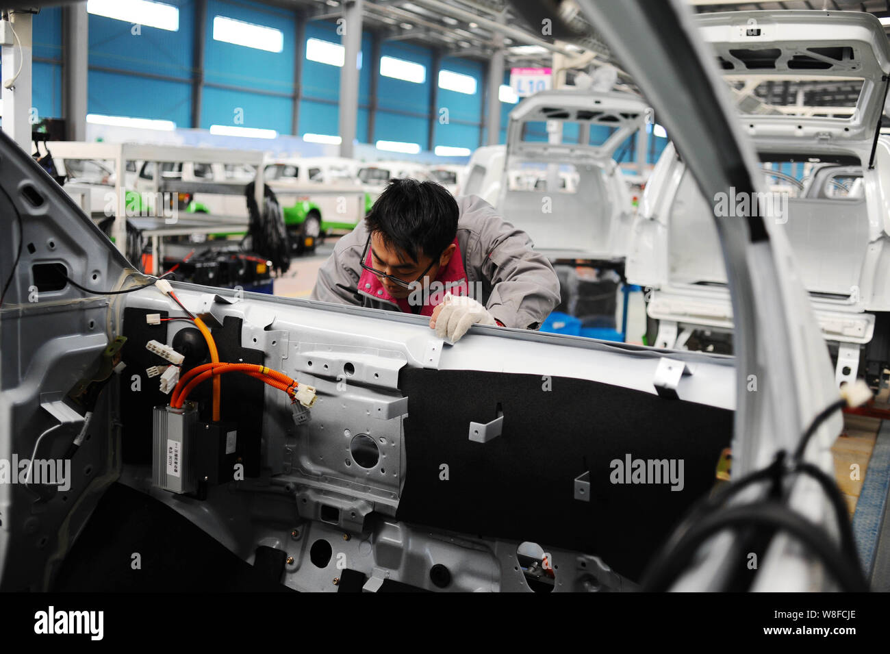 Electric vehicles production and china hi-res stock photography and ...