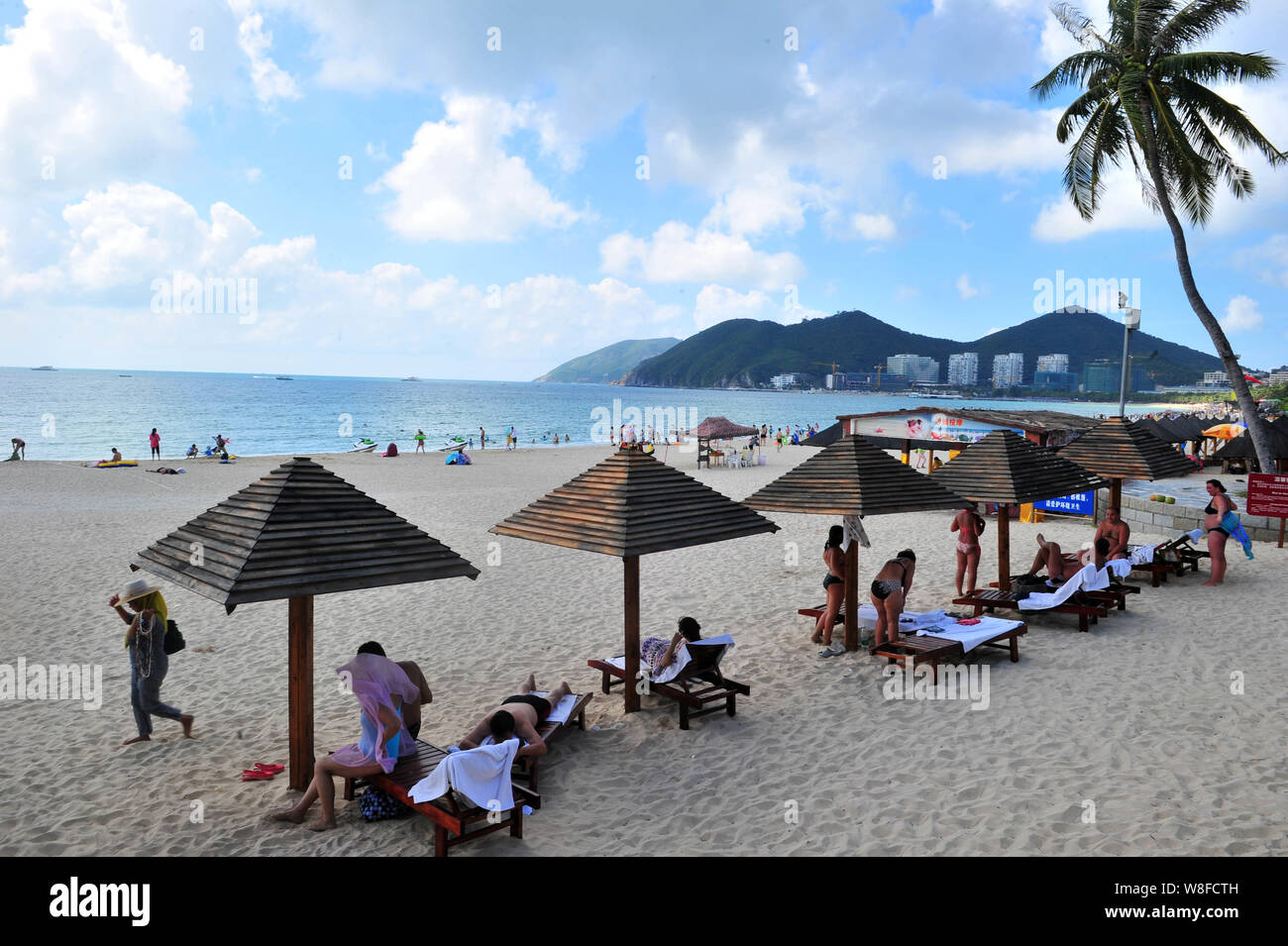 --FILE--Tourists crowd a beach resort in Sanya city, south China's ...
