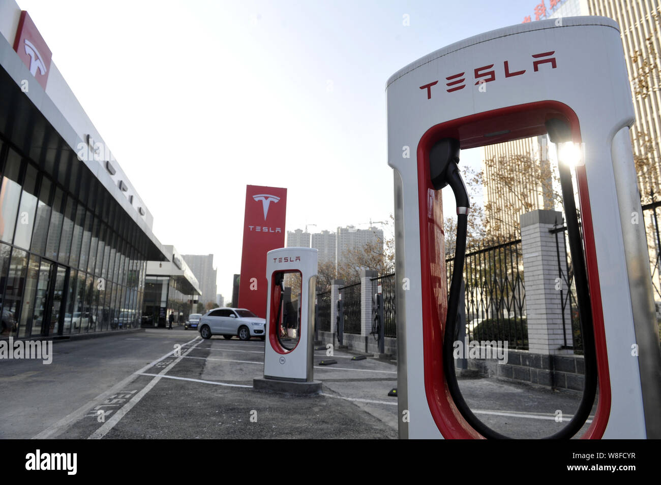 --FILE--Charging posts are pictured at a service center of Tesla in Xi ...
