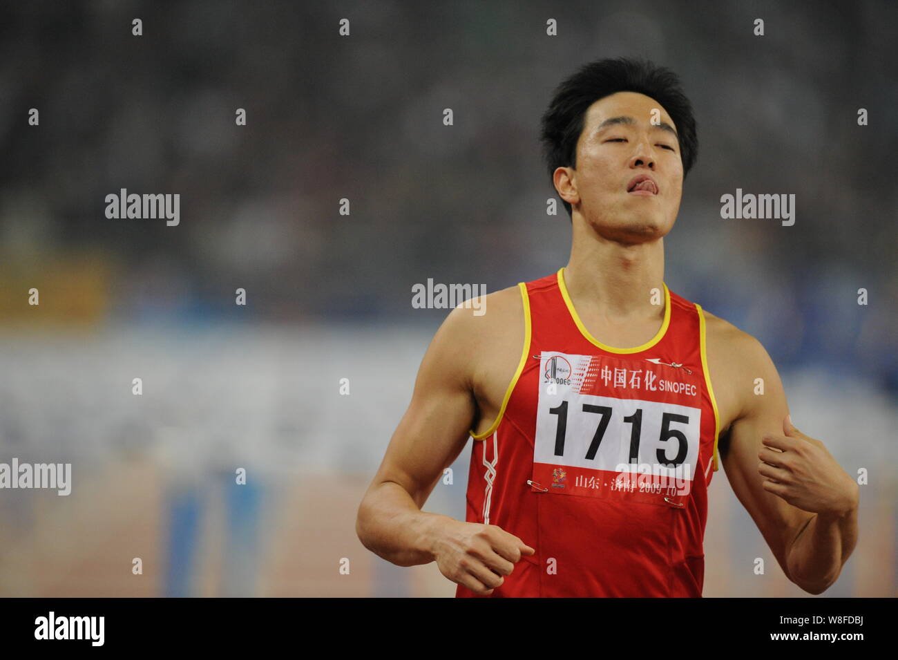 --FILE--Chinese star hurdler Liu Xiang of Shanghai reacts after winning ...