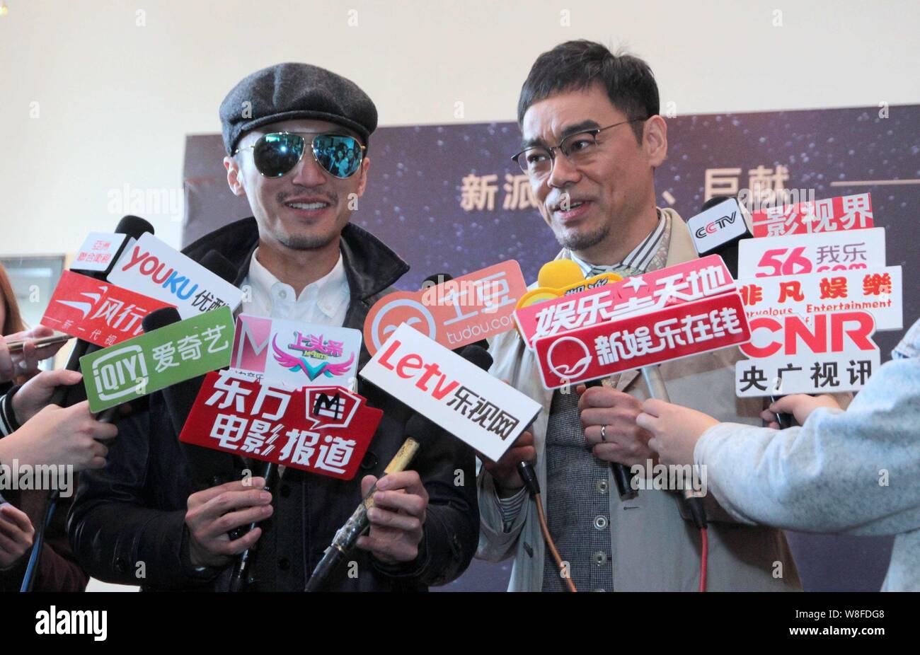 Hong Kong actors Nicholas Tse, left, and Sean Lau are interviewed ...