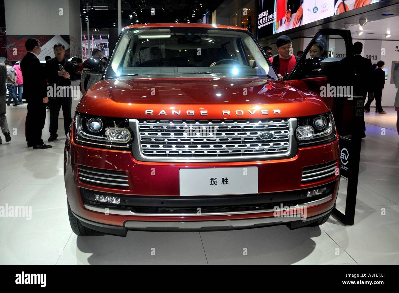 --FILE--Visitors look at a Range Rover of Jaguar Land Rover on display ...