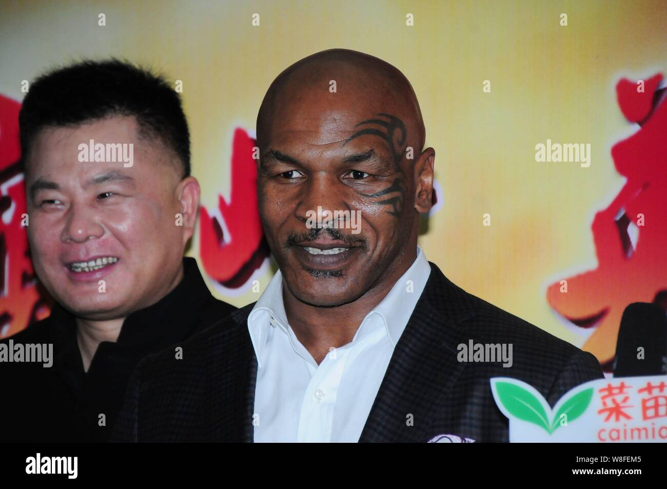 Retired American boxer Mike Tyson, right, poses on the red carpet ...