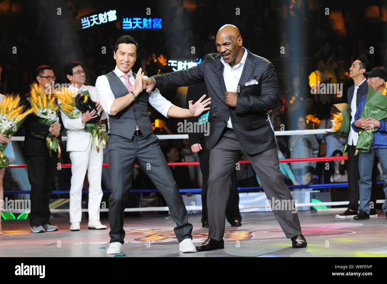 Hong Kong actor Donnie Yen, left, interacts with retired American boxer ...