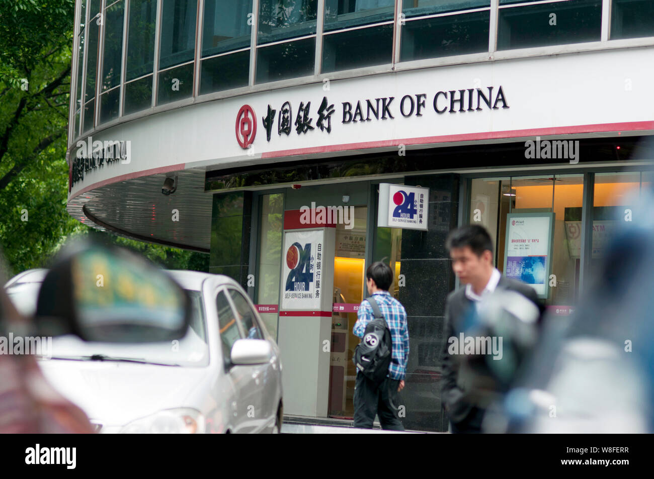 --FILE--Pedestrians walk past a branch of Bank of China (BOC) in ...