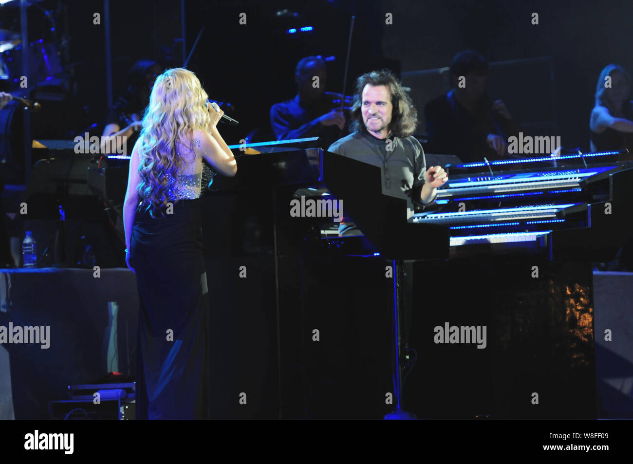 Greek musician Yiannis Hrysomallis, also known as Yanni, right ...