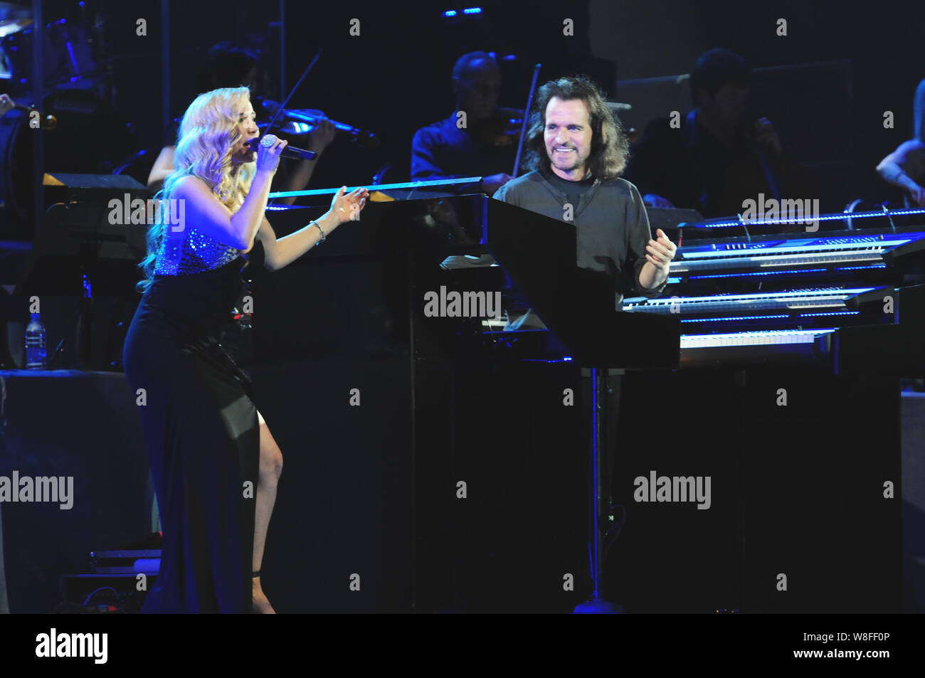 Greek musician Yiannis Hrysomallis, also known as Yanni, right ...