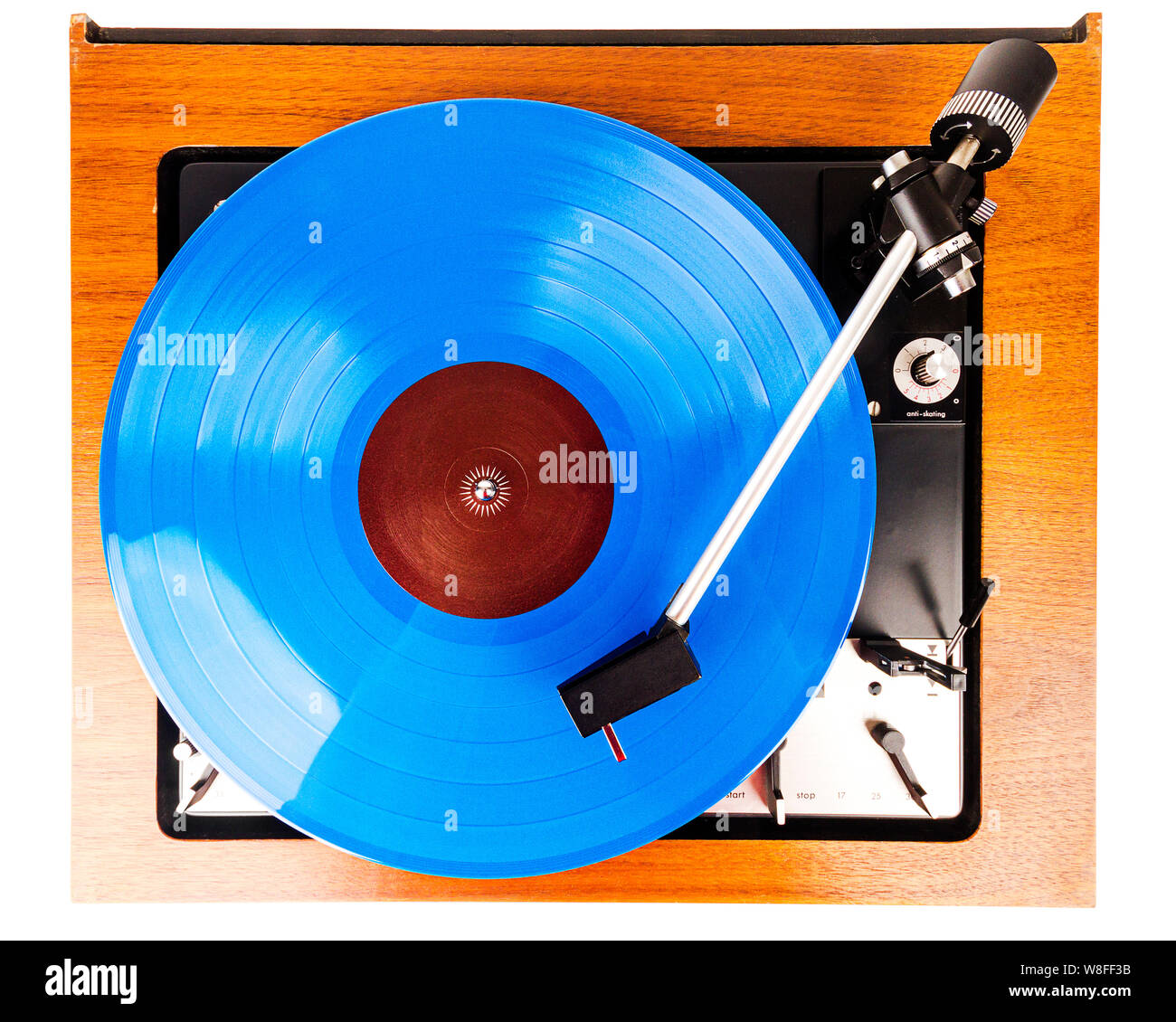 Vintage turntable with a blue vinyl isolated on white. Wooden plinth ...