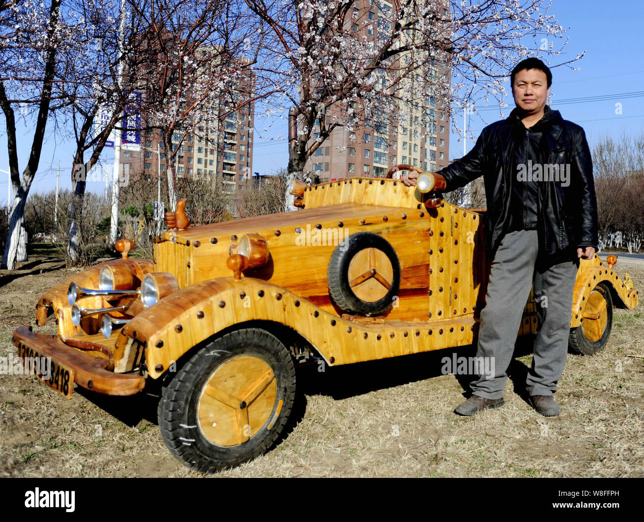 Chinese carpenter Liu Fulong poses with his third homemade wooden ...