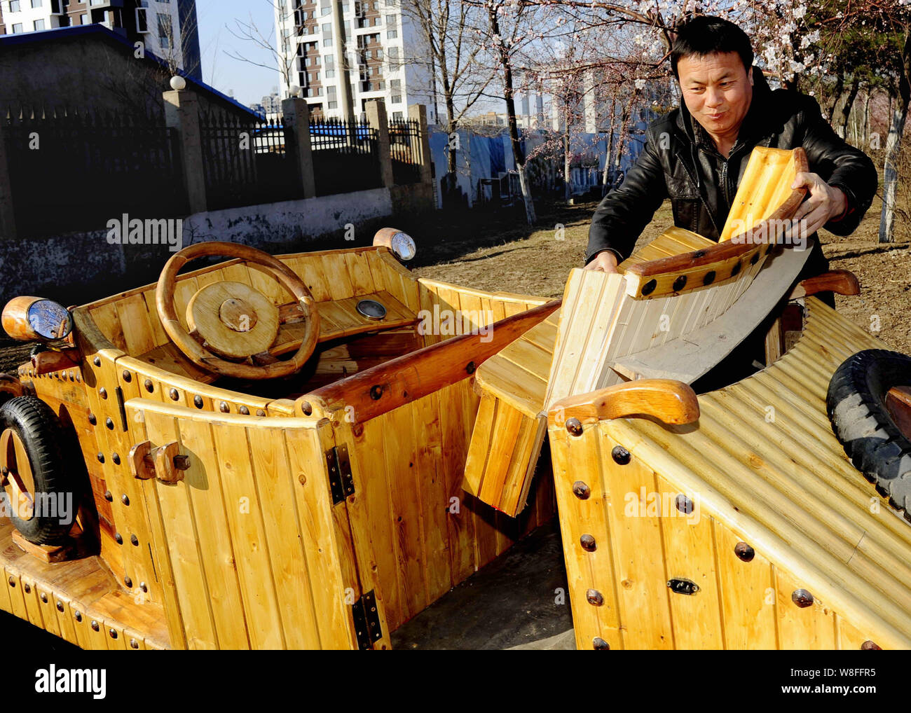 Chinese carpenter Liu Fulong installs the back seat on his third ...