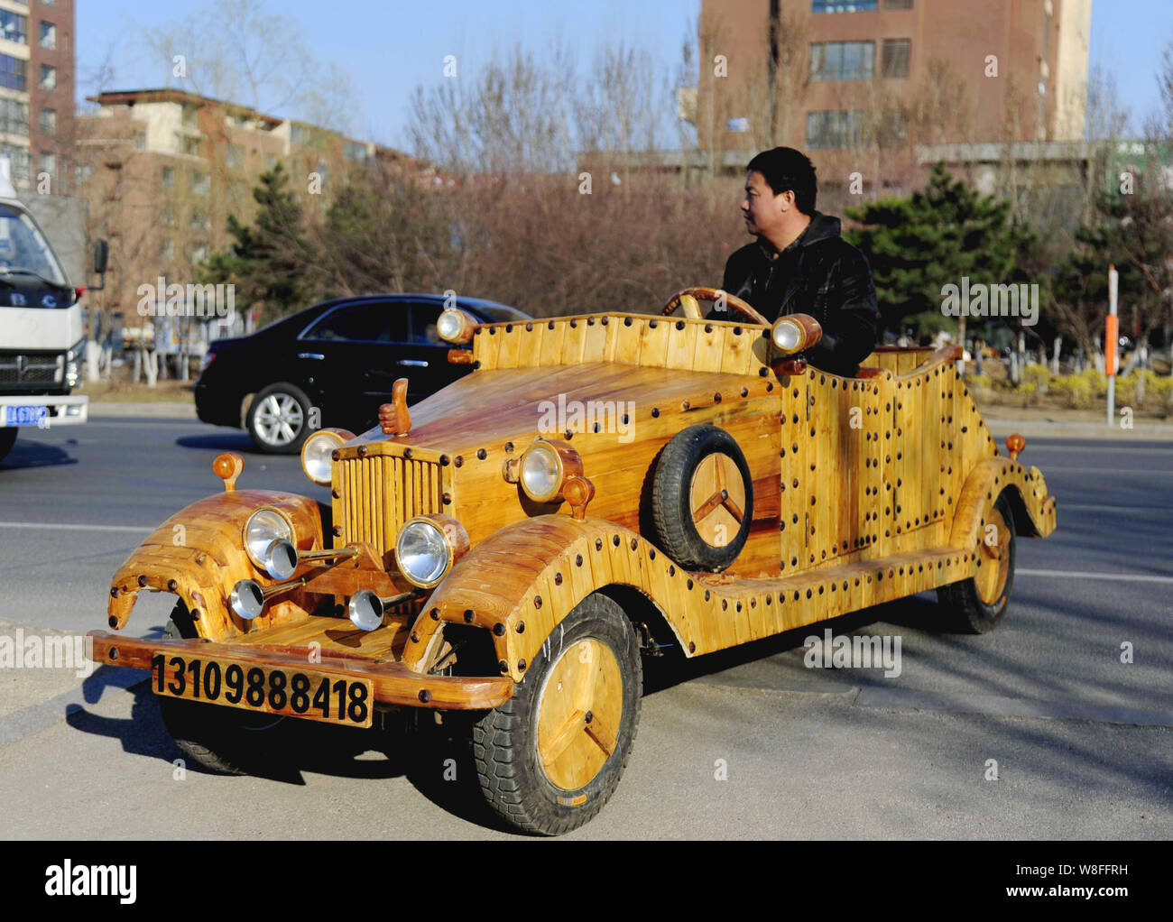 Chinese carpenter Liu Fulong test-drives his third homemade wooden ...