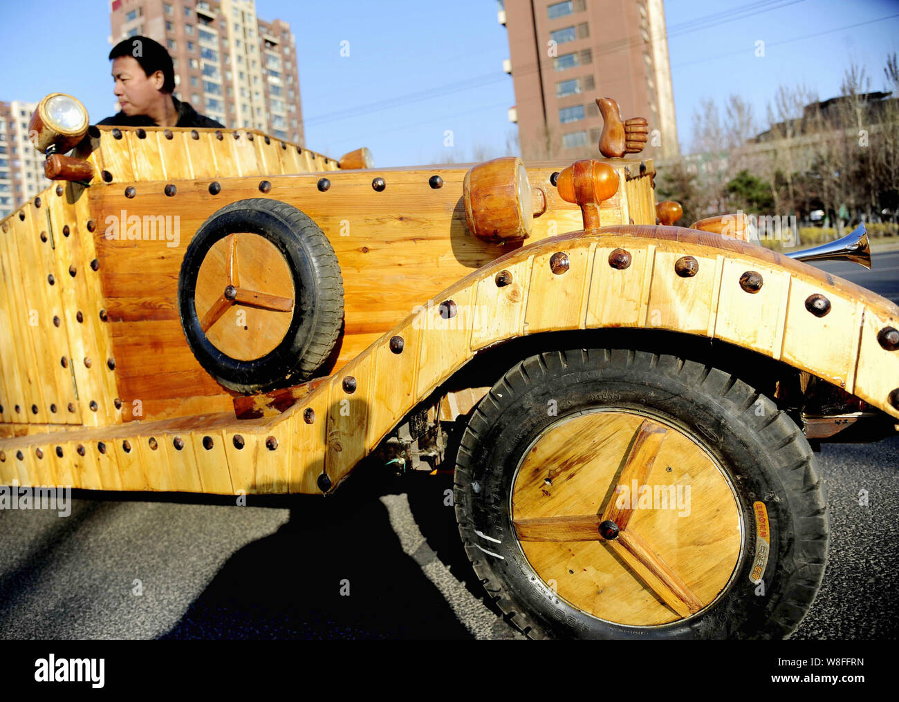 Chinese carpenter Liu Fulong test-drives his third homemade wooden ...