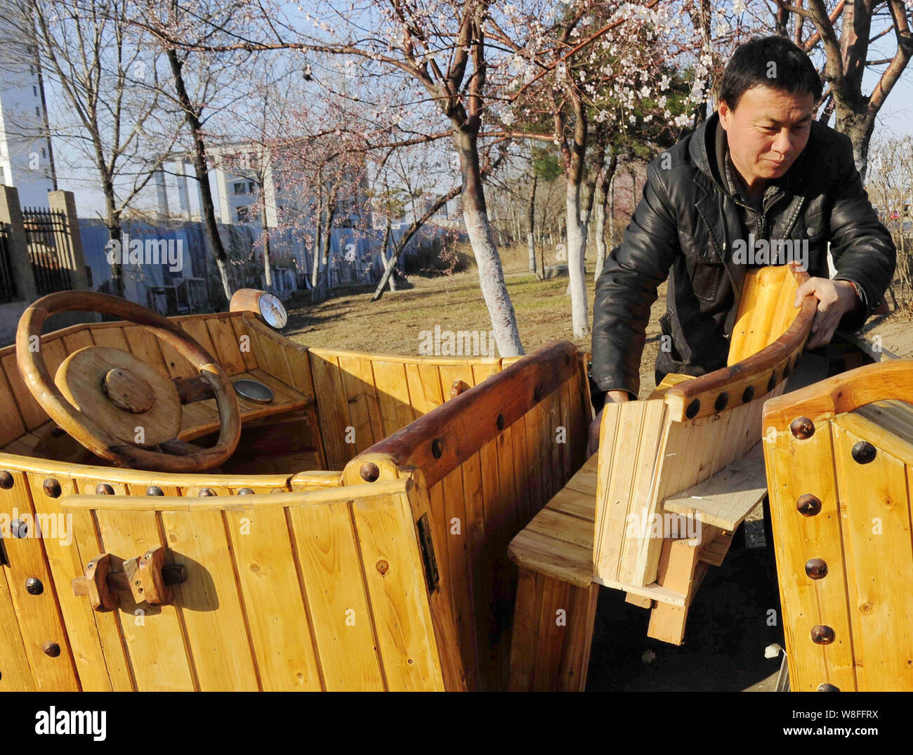 Chinese carpenter Liu Fulong installs the back seat on his third ...