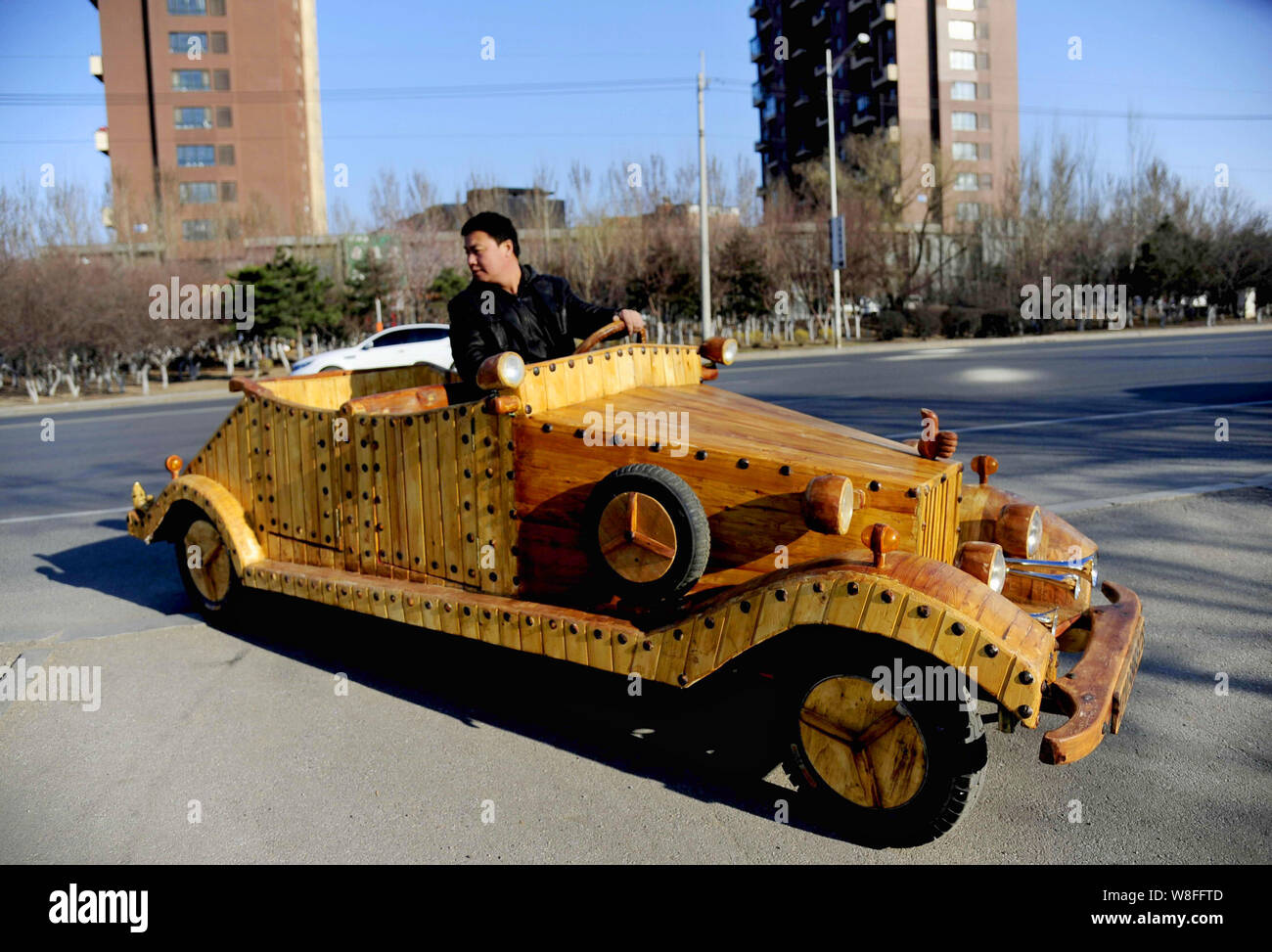 Chinese carpenter Liu Fulong test-drives his third homemade wooden ...