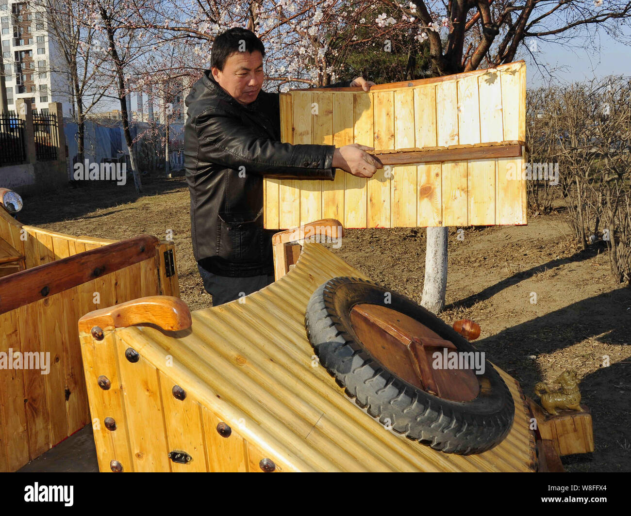 Chinese carpenter Liu Fulong installs the back seat on his third ...