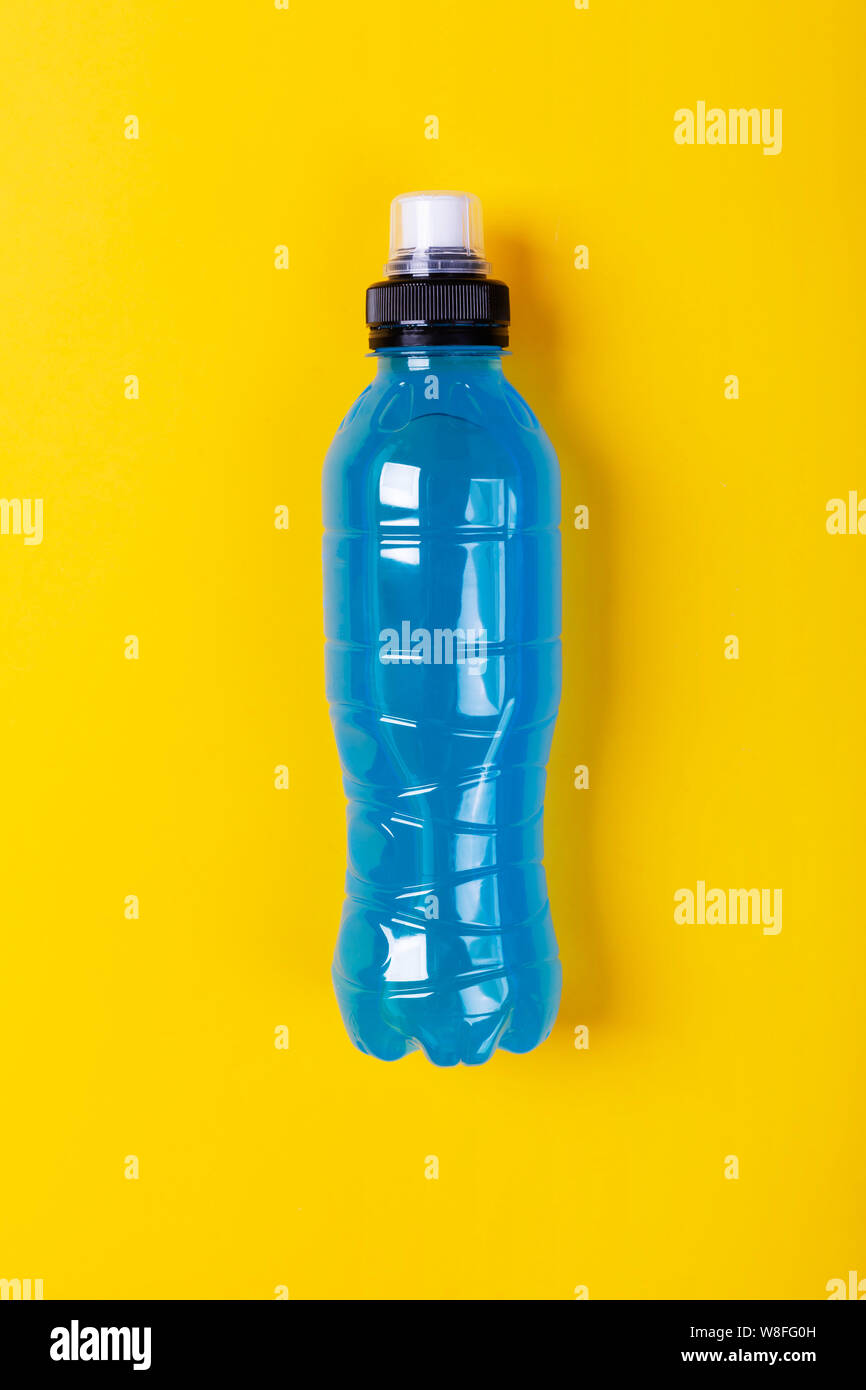 Isotonic energy drink. Bottle with blue transparent liquid, sport ...