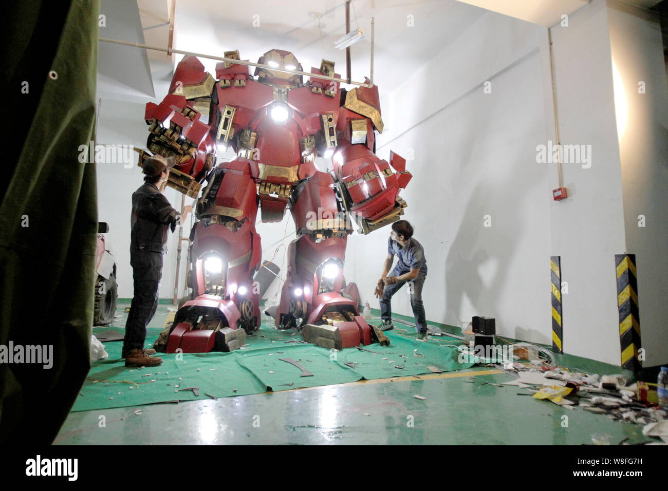 Chinese fine arts teacher Xing Yile, left, and his assistant test the ...