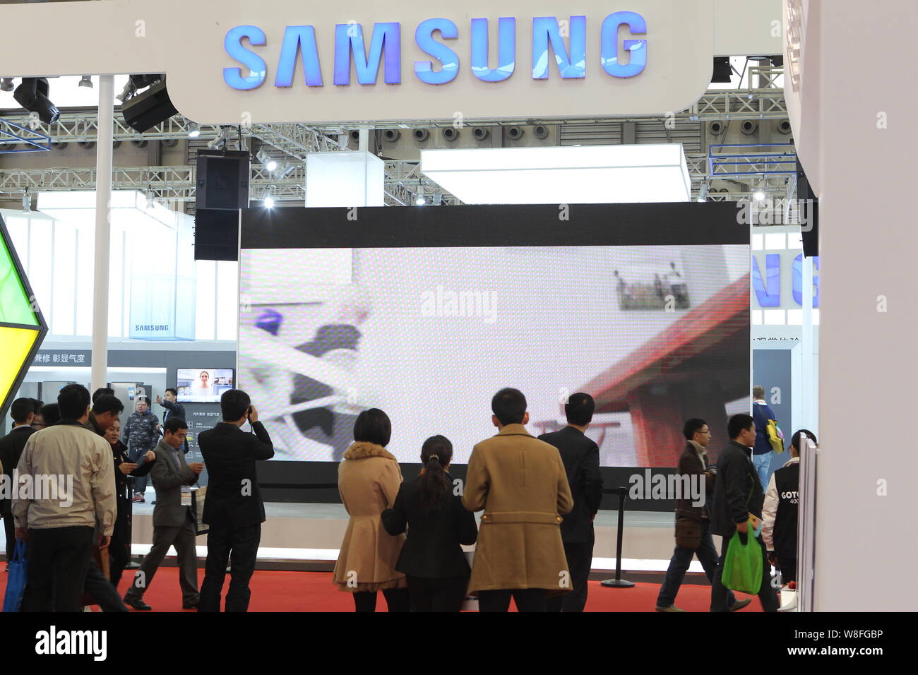 --FILE--People visit the stand of Samsung during an exhibition in ...