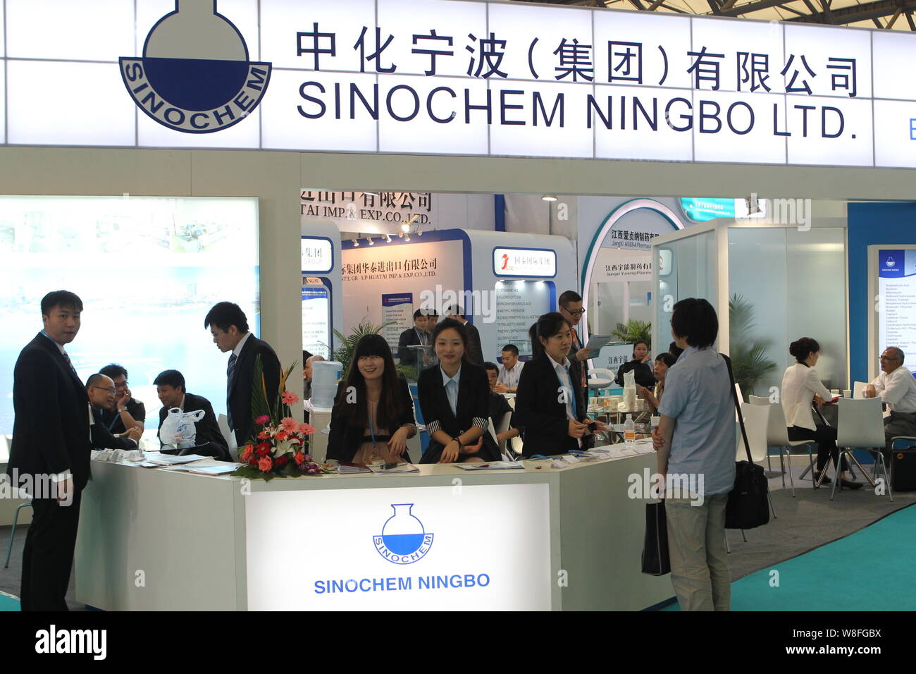 --FILE--People visit the stand of Sinochem Ningbo Ltd. during an ...