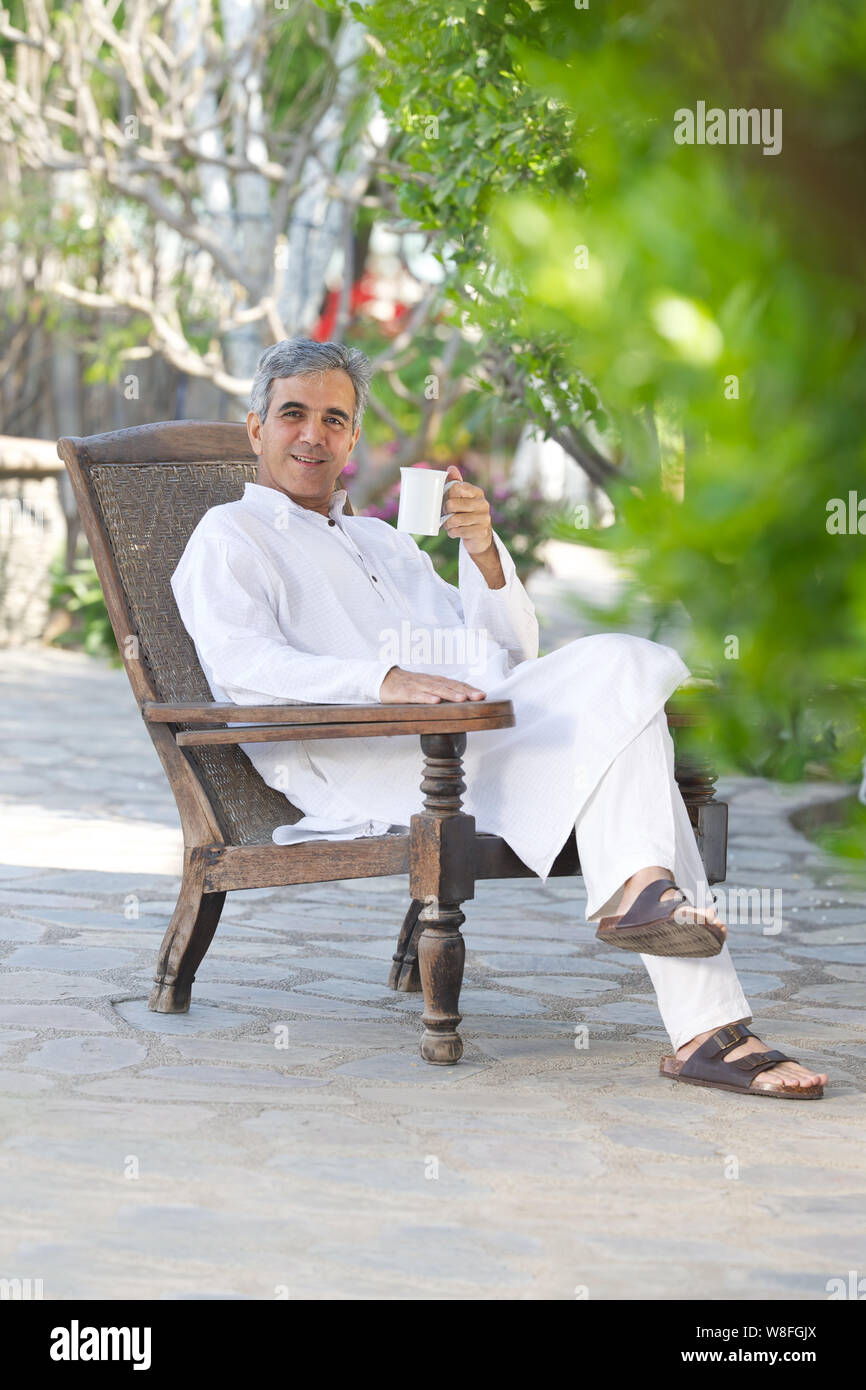 Senior man chair drinking tea hi-res stock photography and images - Alamy