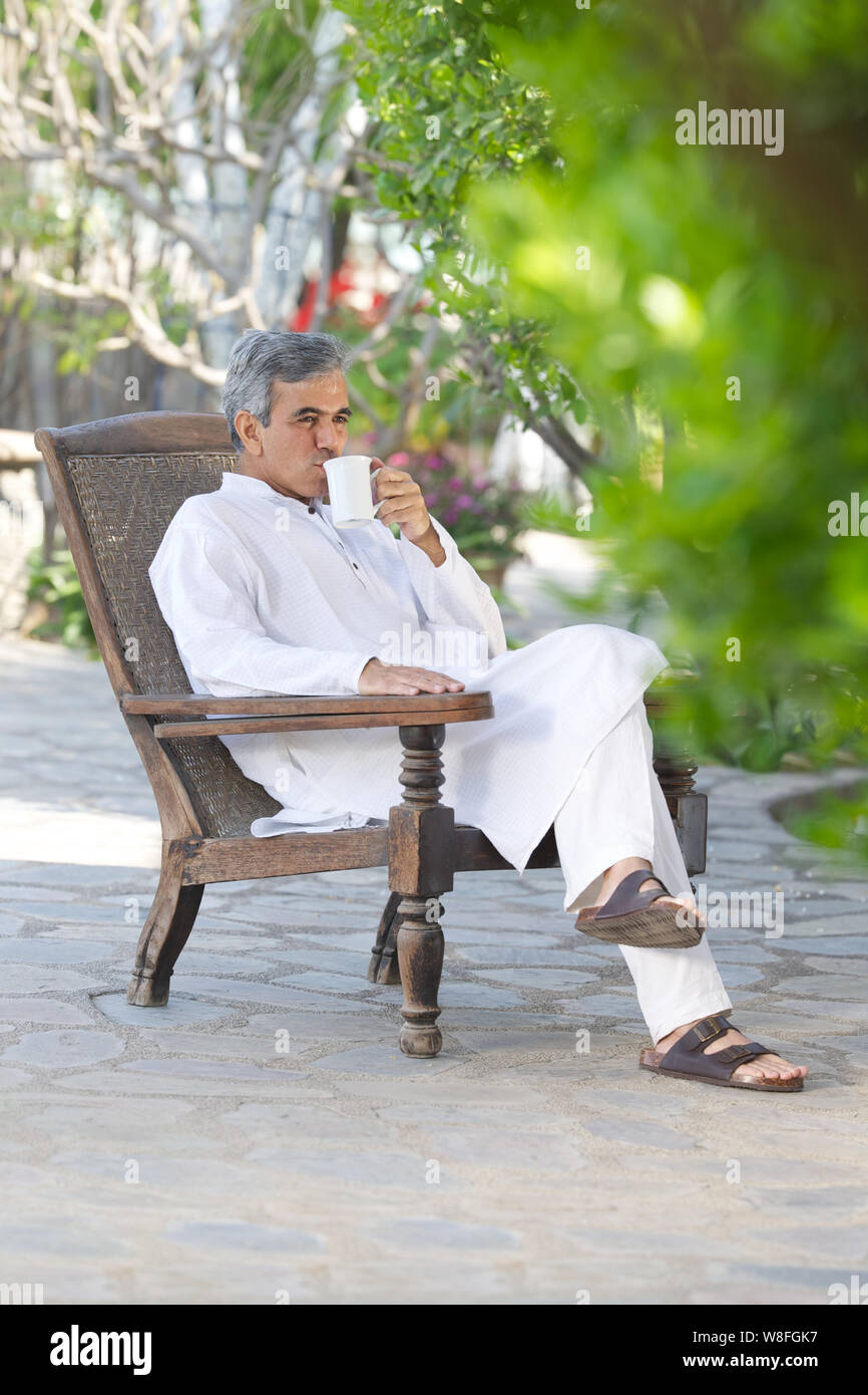Senior man chair drinking tea hi-res stock photography and images - Alamy