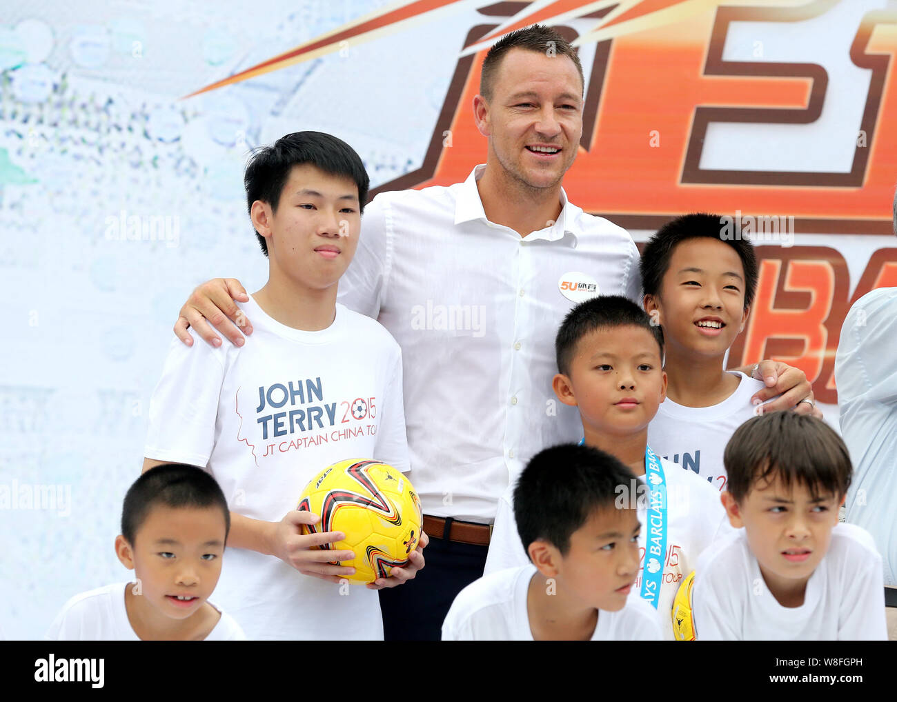 English soccer player John Terry, tallest, poses for photos with young ...