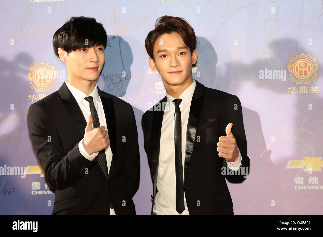 Lay, left, and Chen of Chinese-South Korean boy group EXO pose on the ...