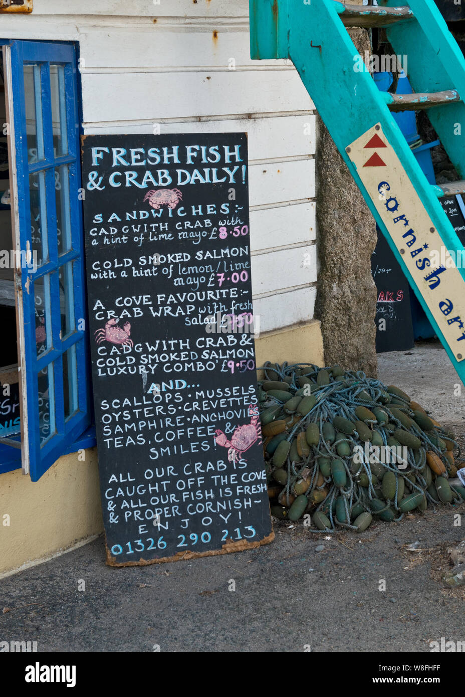 Signs advertsing sale of fish and crabs from small local fisherman's ...