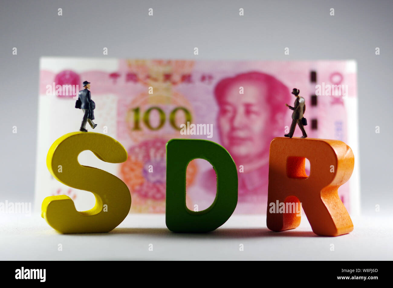 Illustration of RMB (renminbi) yuan banknotes and SDR (Special Drawing ...