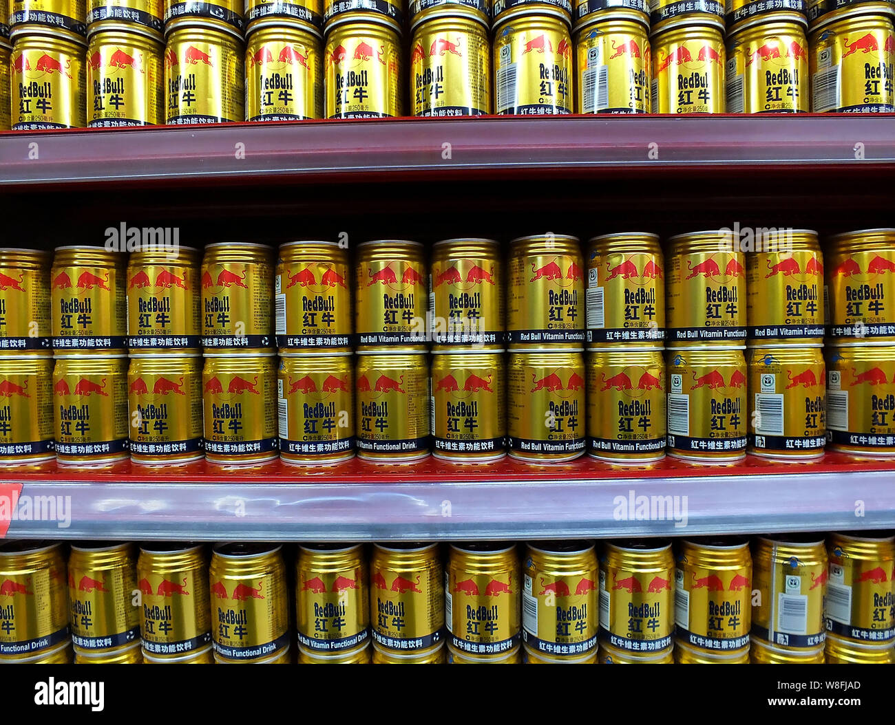 --FILE--Cans of Red Bull energy drink on a shelf at a supermarket are ...