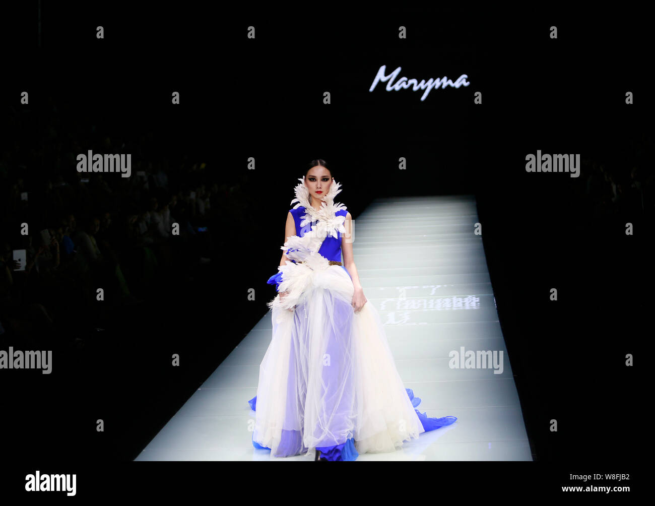 A model displays a new creation by Chinese fashion designer Mary Ma in ...