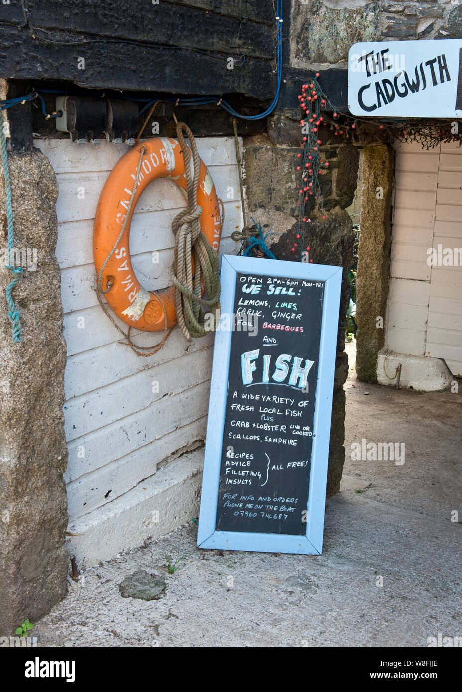 Signs advertsing sale of fish and crabs from small local fisherman's ...