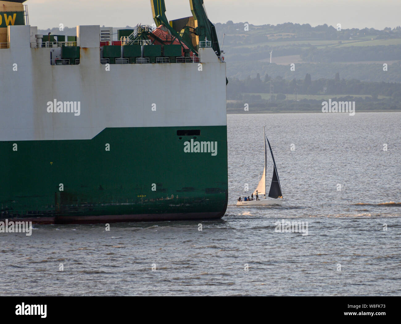 Ship and yacht near collision Stock Photo - Alamy