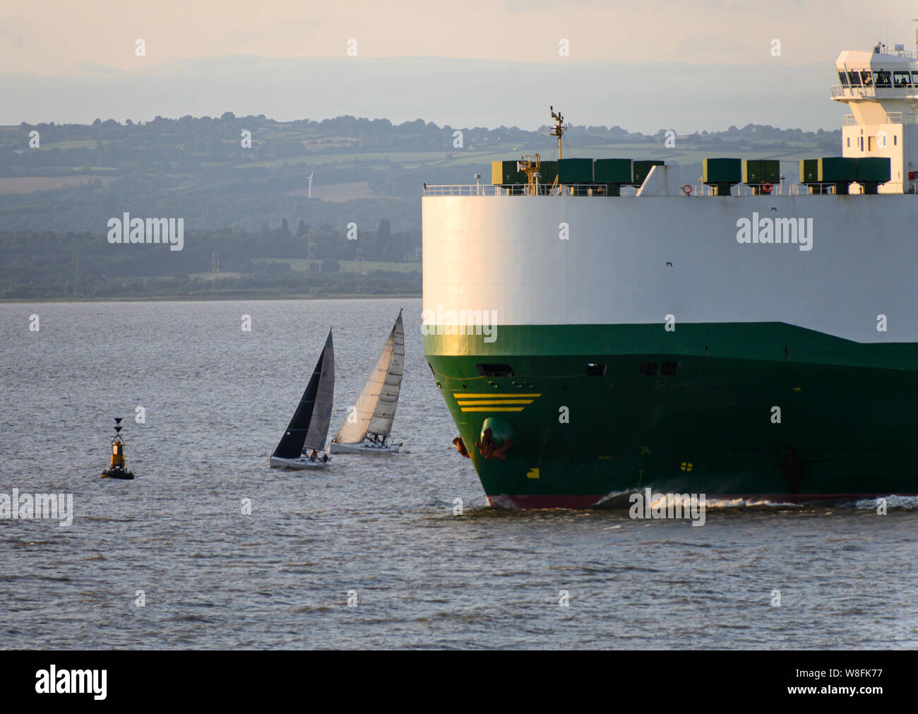 Ship and yachts near collision Stock Photo - Alamy