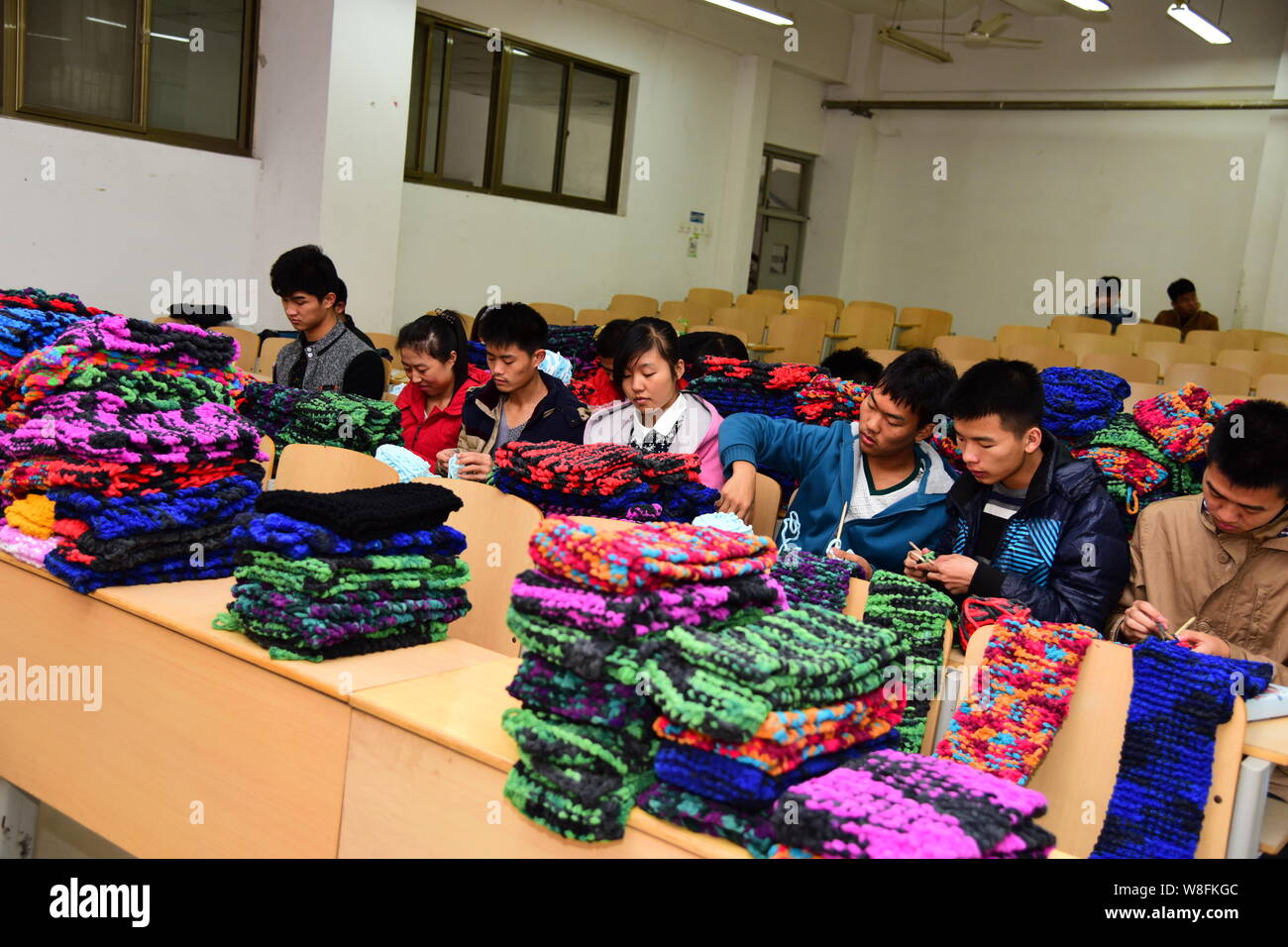 Young Chinese students knit scarves in a classroom at North China ...