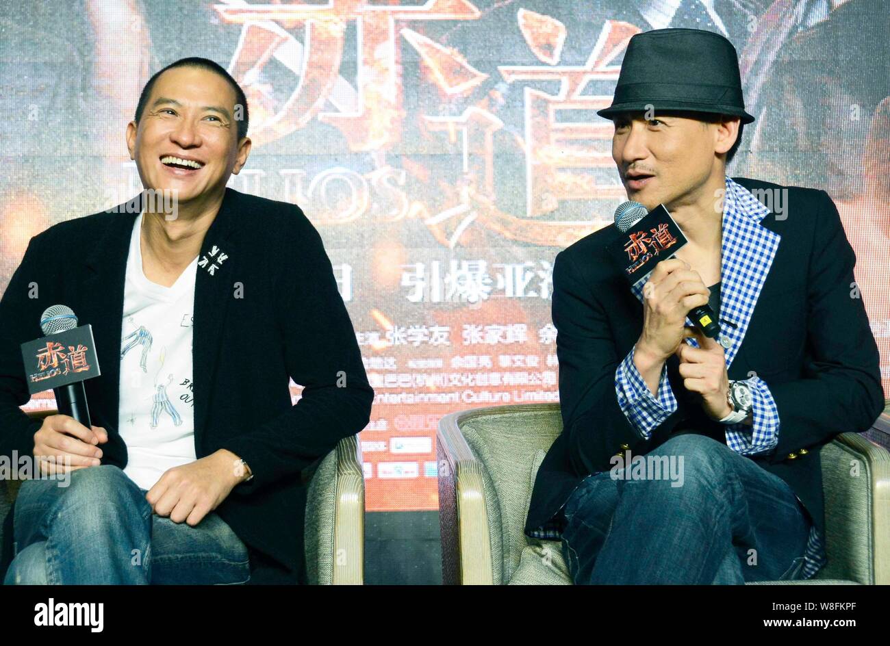 Hong Kong singers and actors Jacky Cheung, left, and Nick Cheung react ...