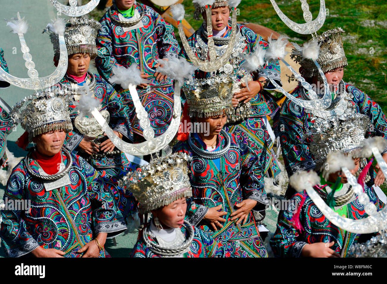 Chinese women of Miao ethnic minority in traditional costumes attend ...