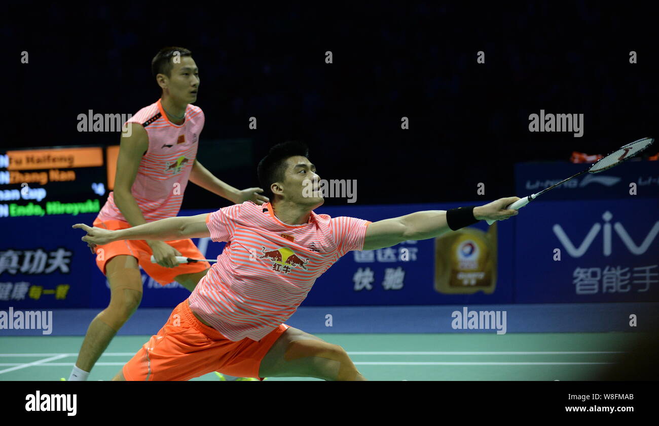 Fu Haifeng, left, and Zhang Nan of China compete against Hiroyuki Endo ...