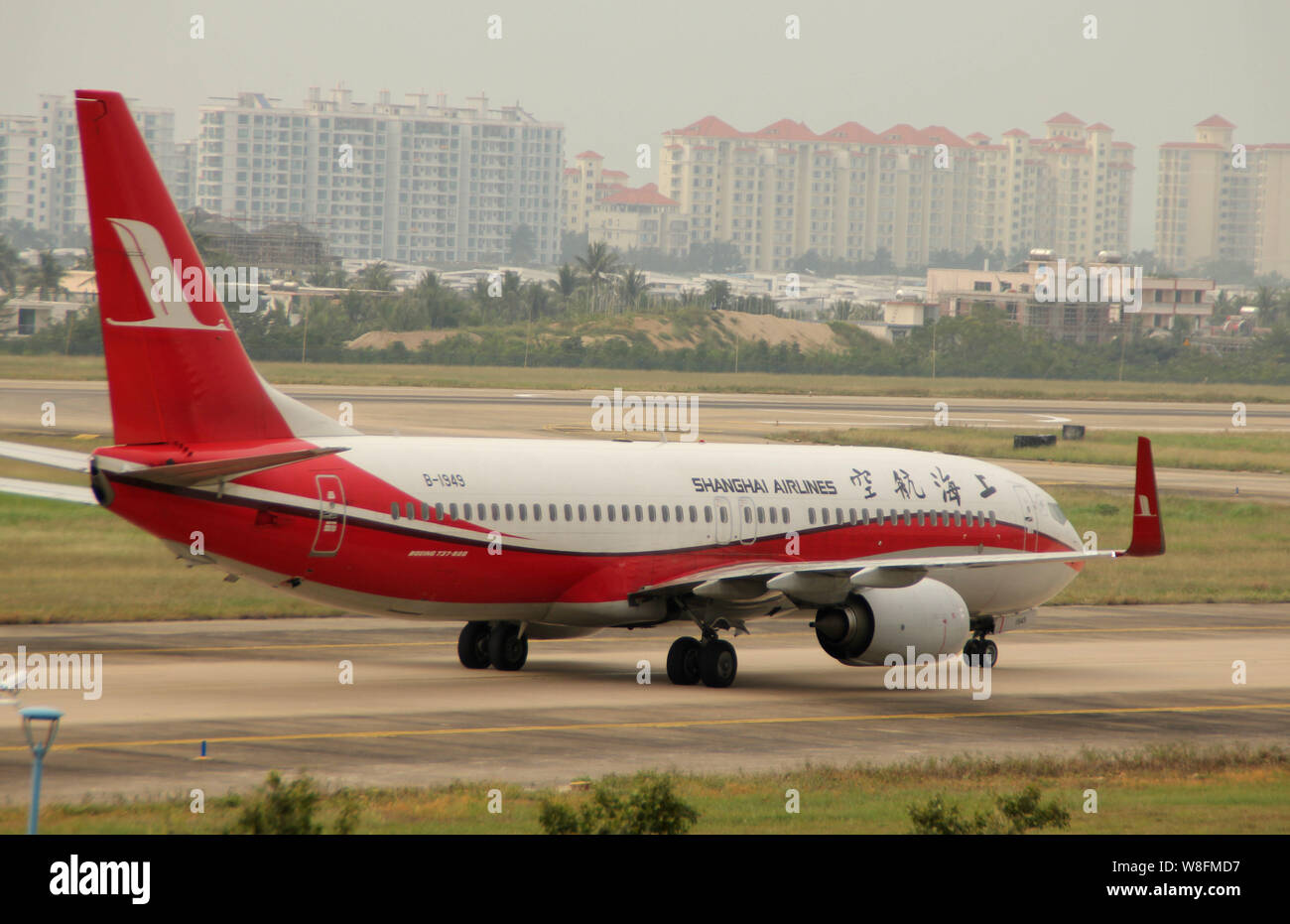 --FILE--A plane of Shanghai Airlines takes off from the Sanya Phoenix ...