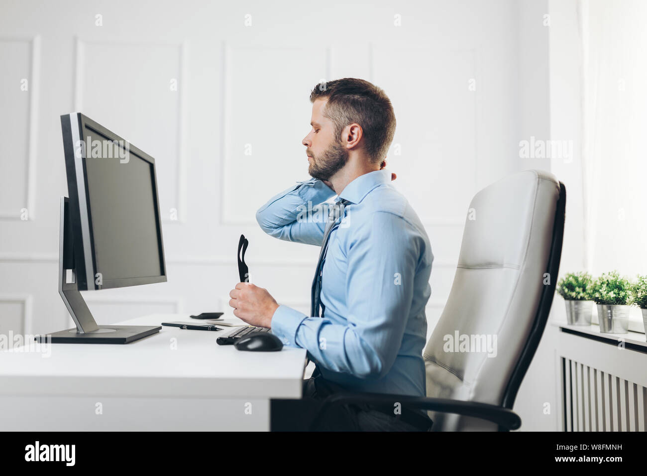 Man sitting back desk office not woman hi-res stock photography and ...