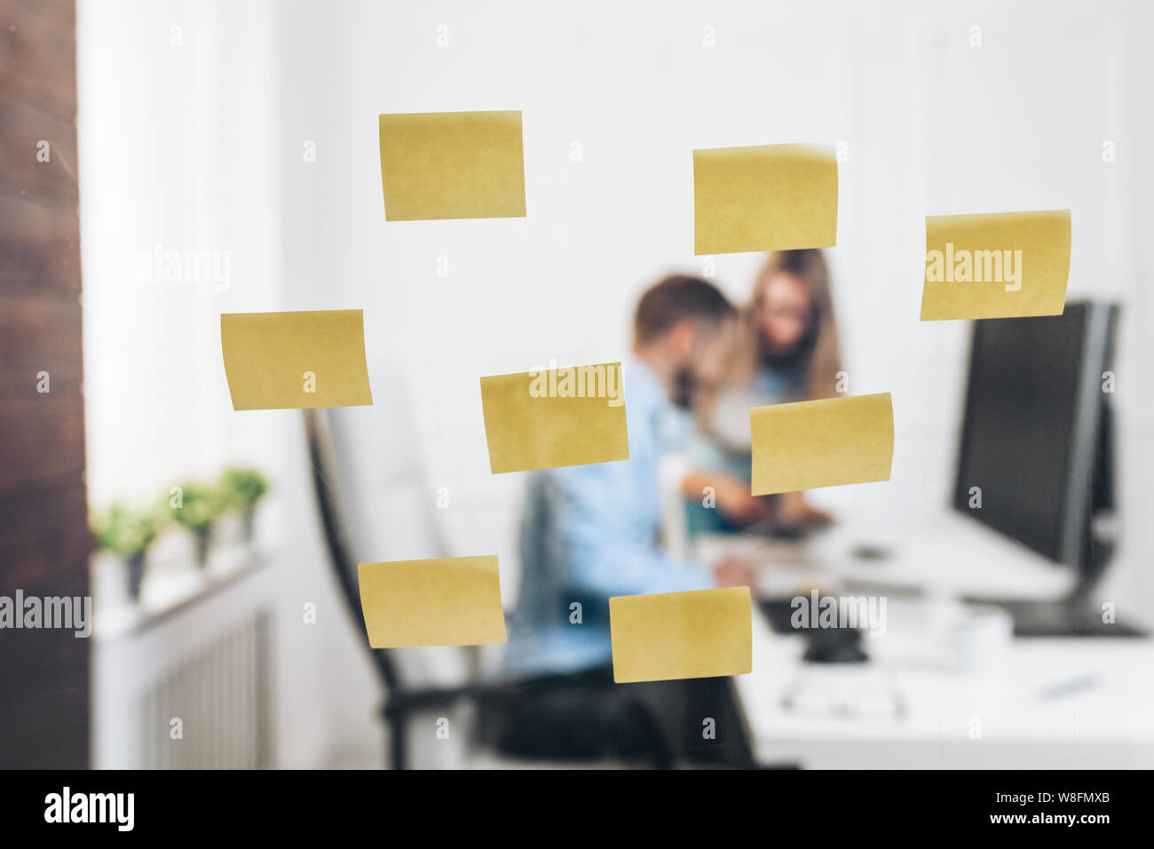 Boss sitting behind desk employees hi-res stock photography and images ...