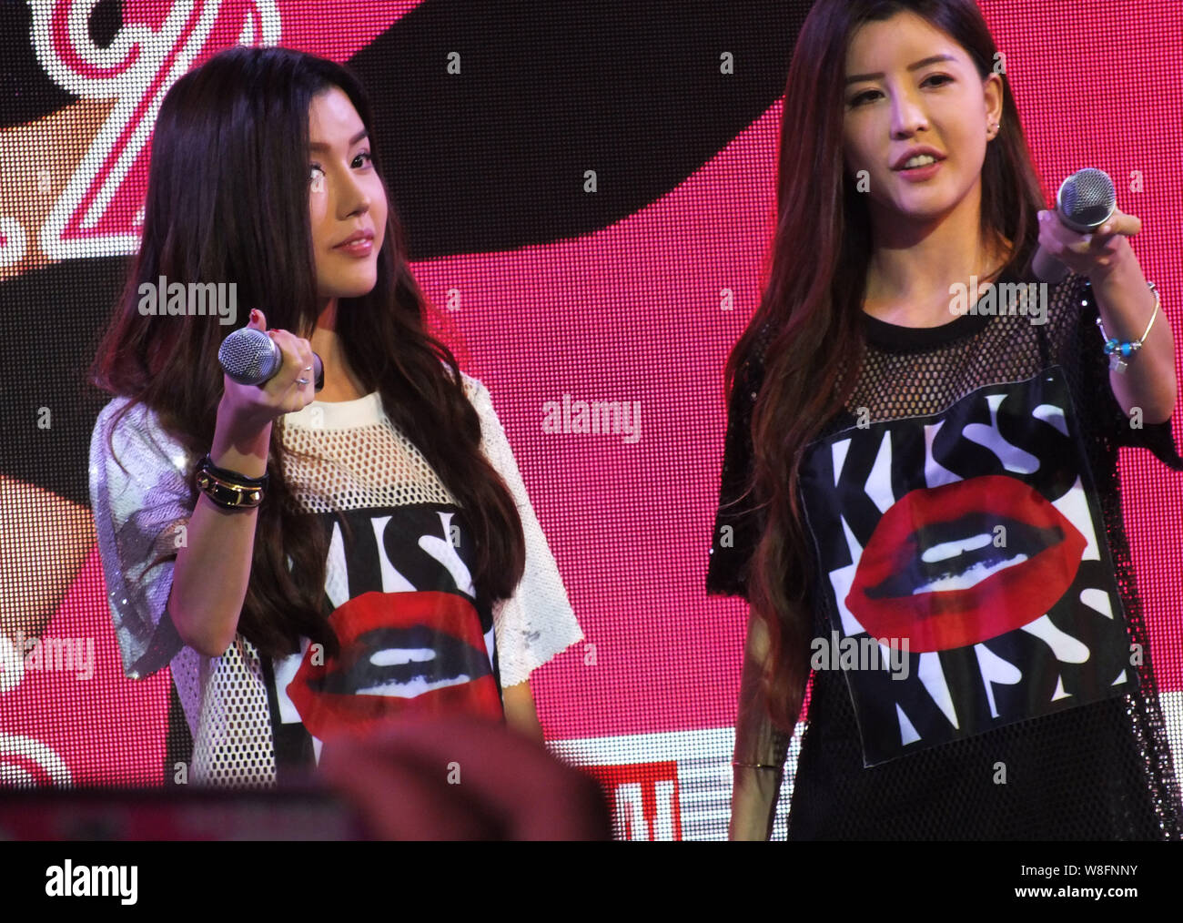 The twin sisters Miko and Yumi of Singaporean pop duo BY2 attend a ...