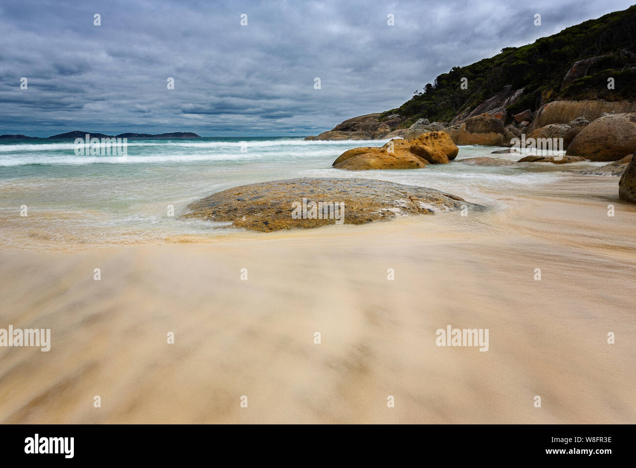 Waves rearranging the sand on Squeaky Beach Stock Photo - Alamy