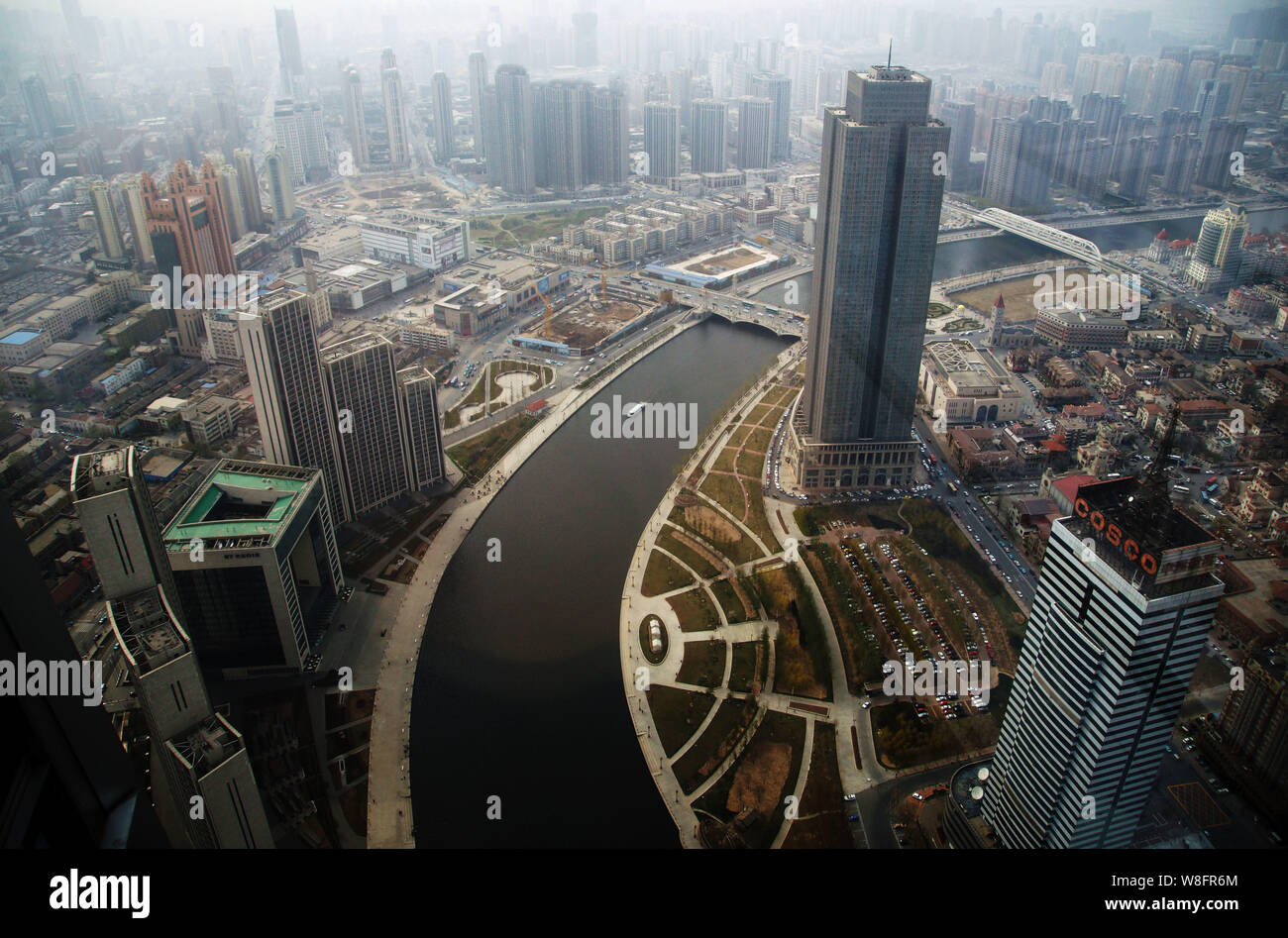 --FILE--Aerial view of houses and high-rise buildings along the Haihe ...